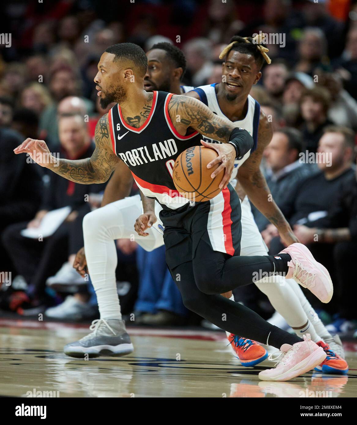 Portland Trail Blazers guard Damian Lillard, left, dribbles past Dallas ...