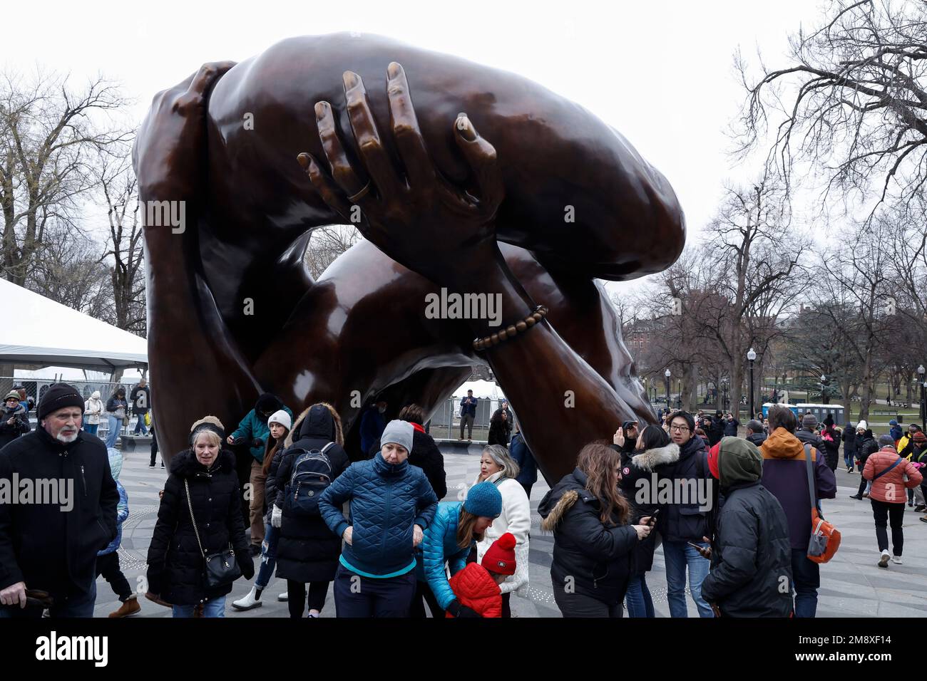 People visit the sculpture entitled “The Embrace “ by artist Hank ...