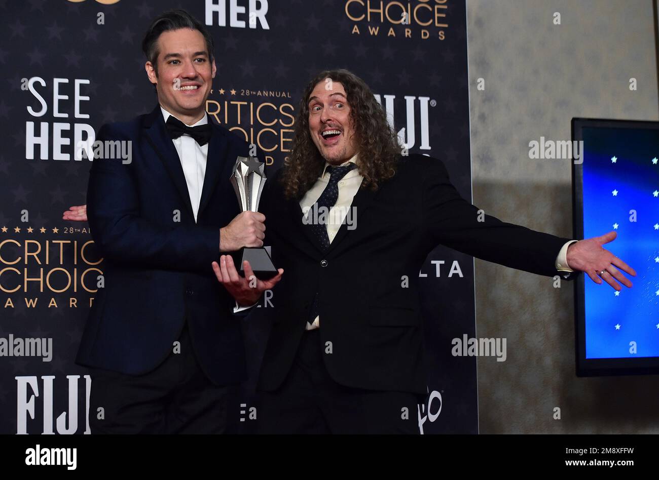Eric Appel, left, and "Weird" Al Yankovic pose in the press room with ...
