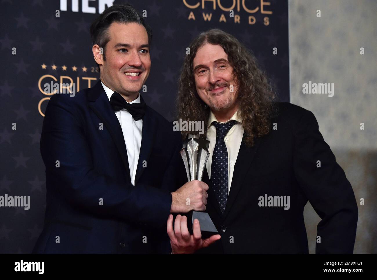Eric Appel, left, and "Weird" Al Yankovic pose in the press room with ...