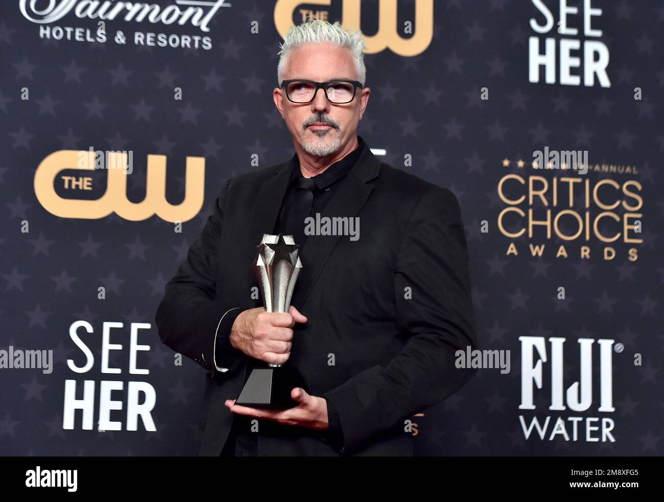 Jason Baird poses with the award for best hair and makeup for "Elvis ...