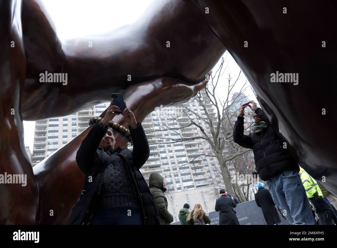 People visit the sculpture entitled “The Embrace “ by artist Hank ...