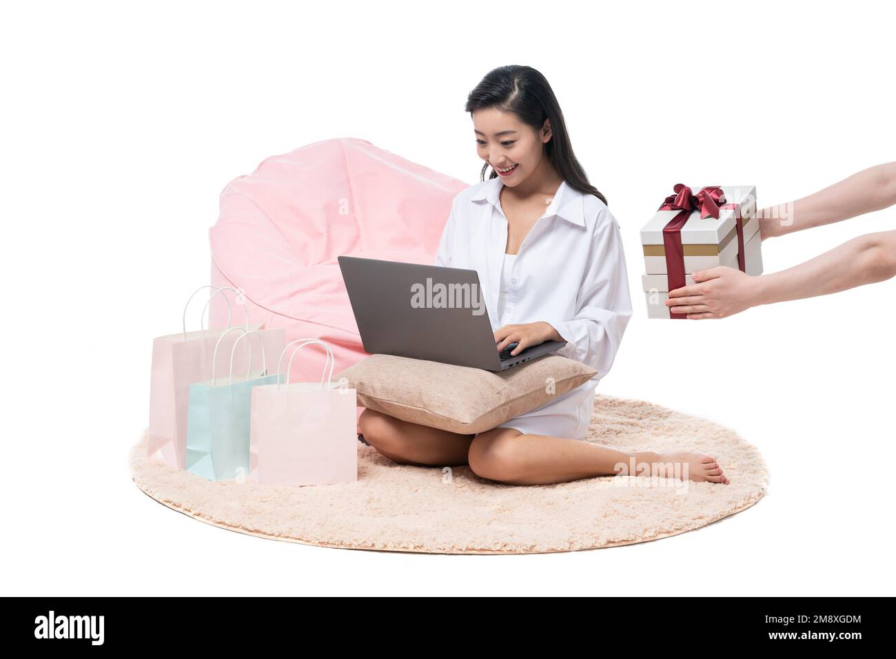 Young woman to sign for a gift Stock Photo - Alamy