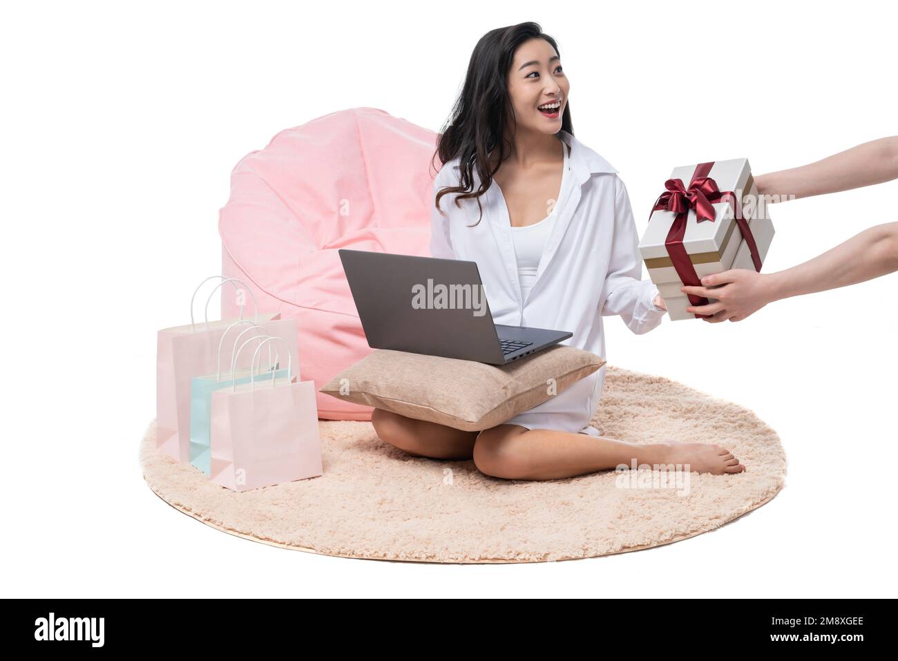 Young woman to sign for a gift Stock Photo - Alamy