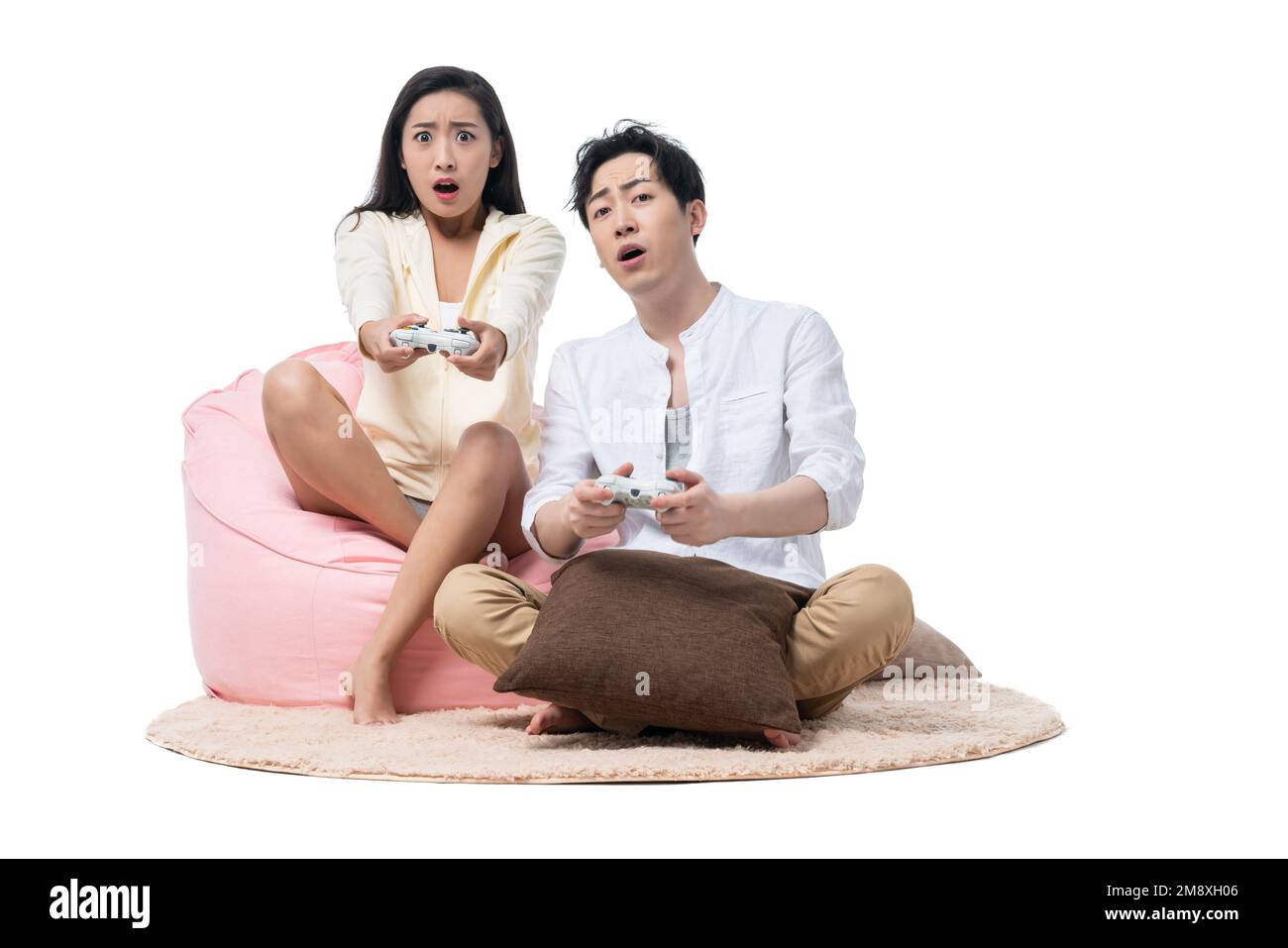 Young couple together playing computer games Stock Photo - Alamy