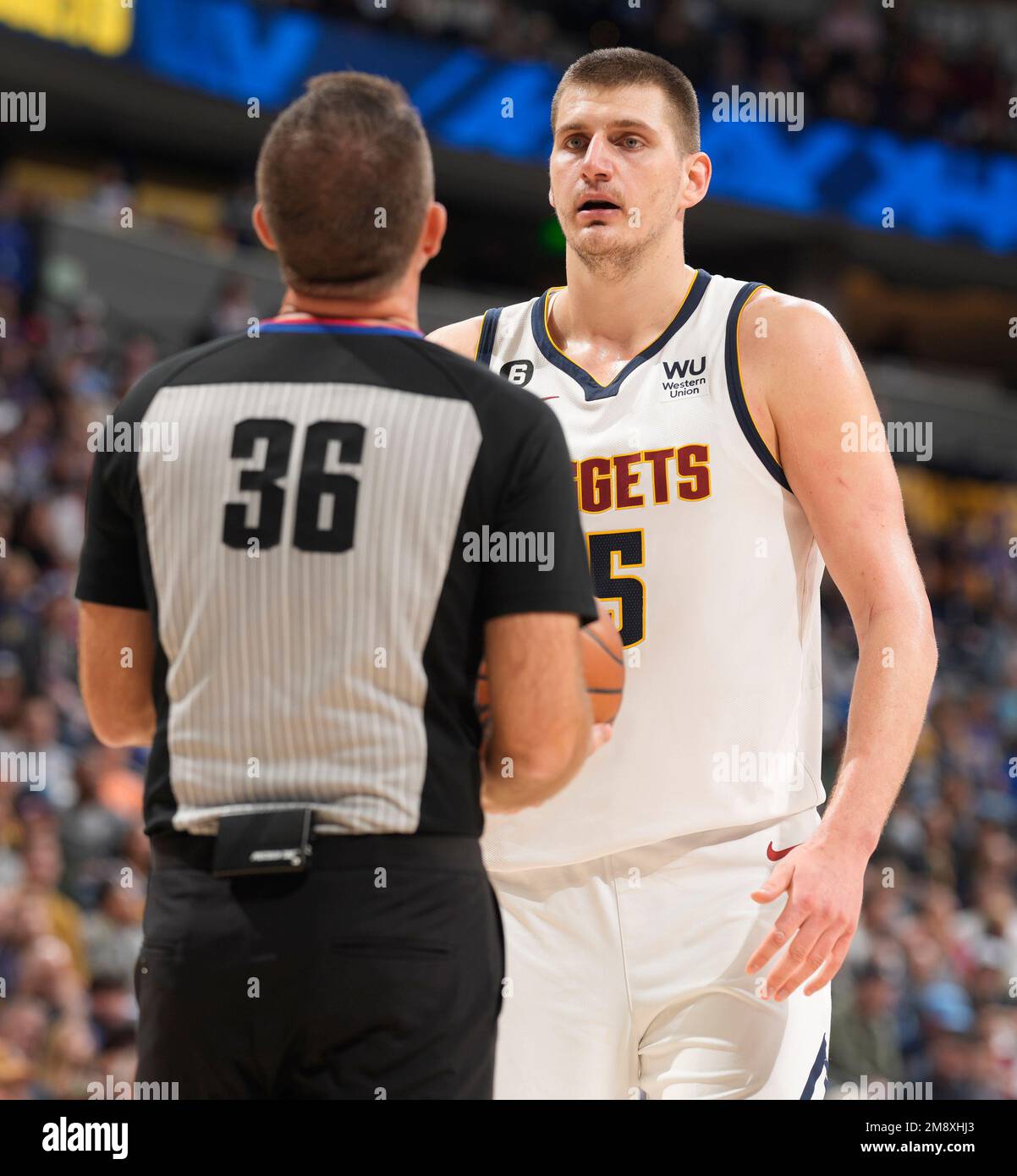 Denver Nuggets center Nikola Jokic, right, confers with referee Brent ...