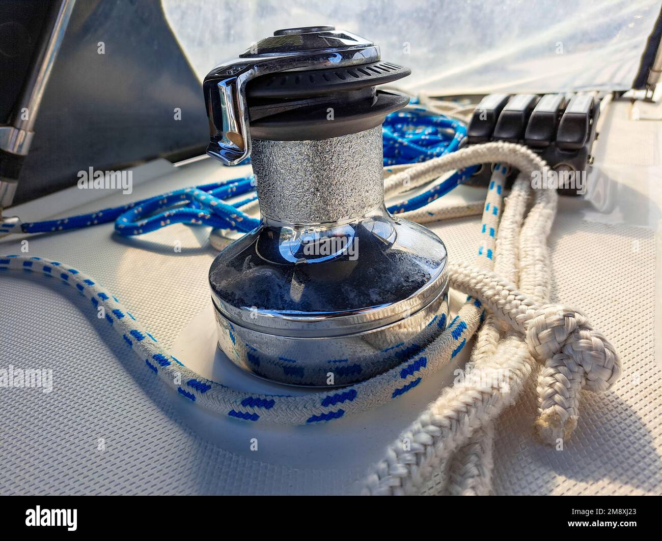 Winch on a sailboat while sailing Stock Photo - Alamy