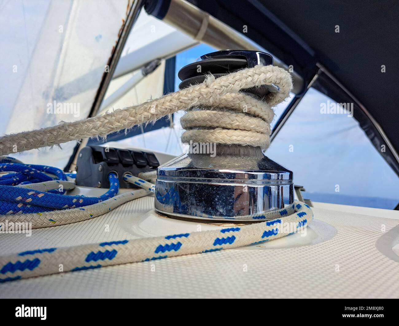 Winch on a sailboat while sailing Stock Photo - Alamy