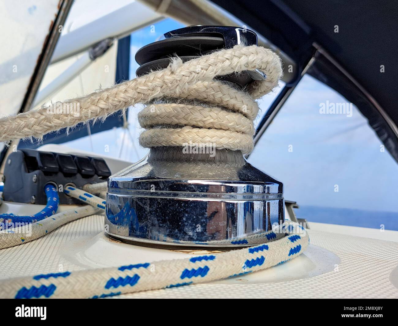 Winch on a sailboat while sailing Stock Photo - Alamy