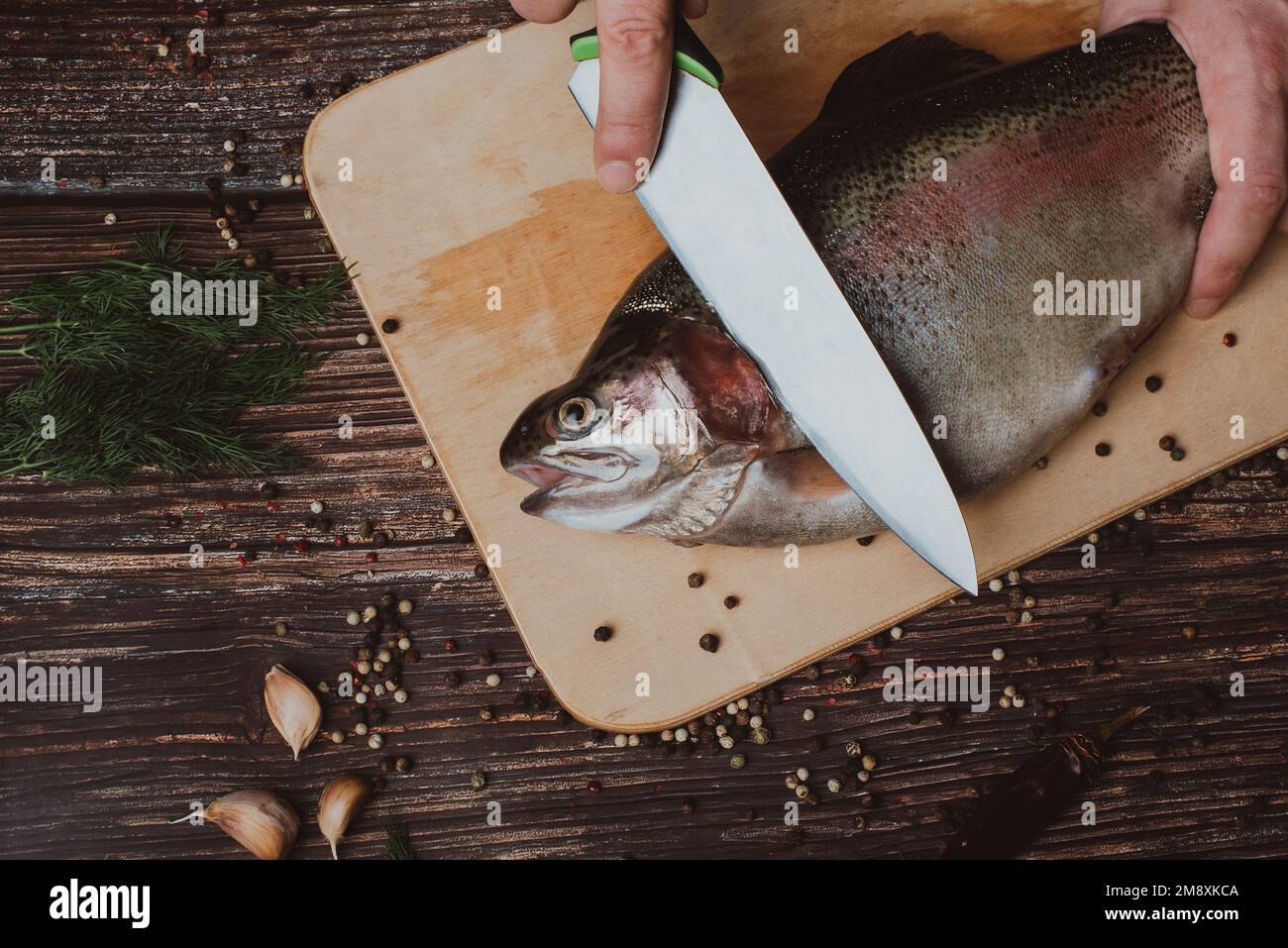 Male chef cuts red fish hi-res stock photography and images - Alamy