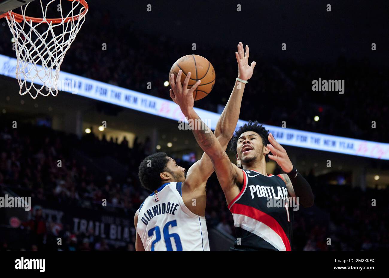 Portland Trail Blazers guard Anfernee Simons, right, shoots over Dallas ...