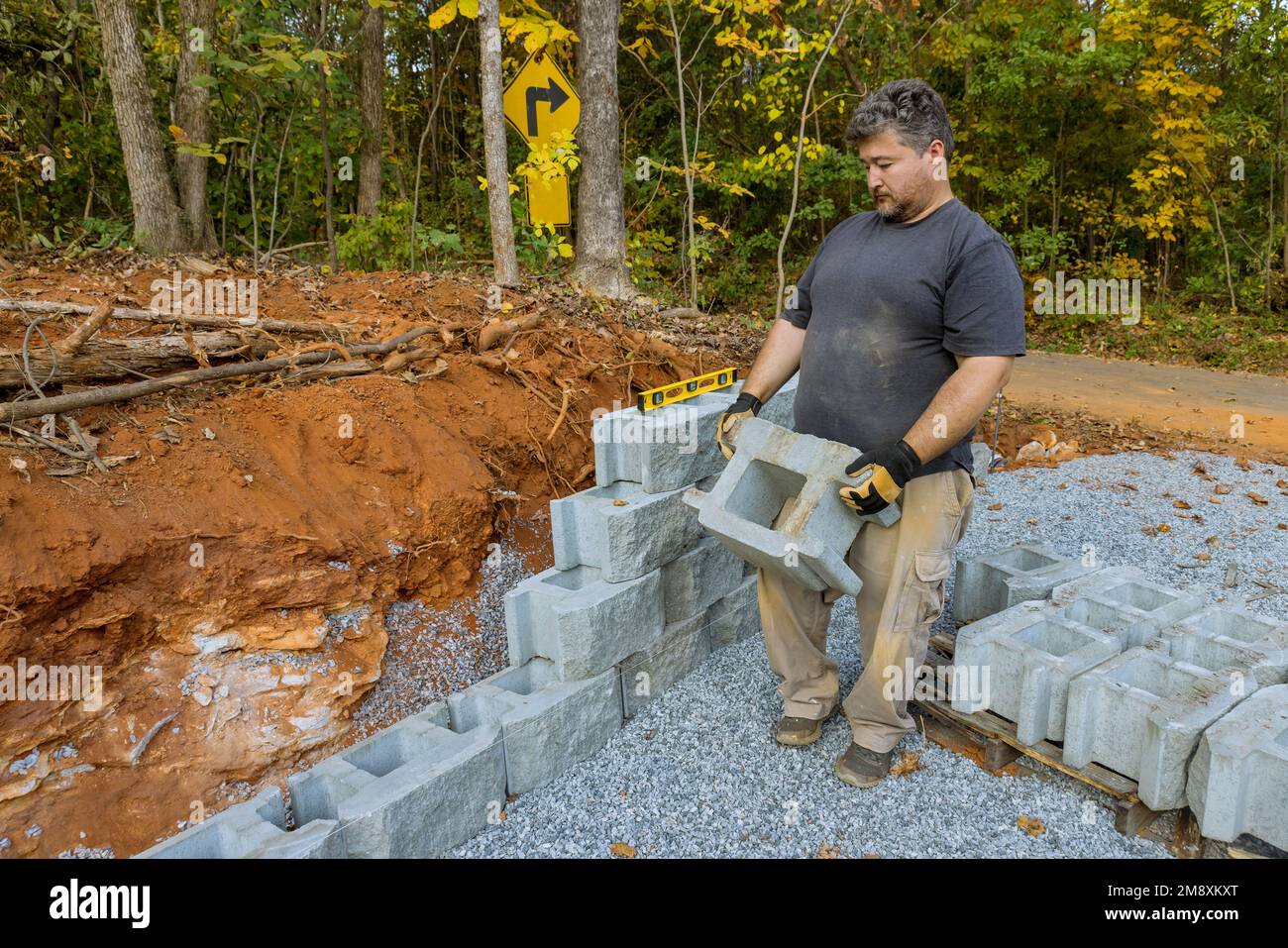 On construction site of new large block retaining wall contractor was ...