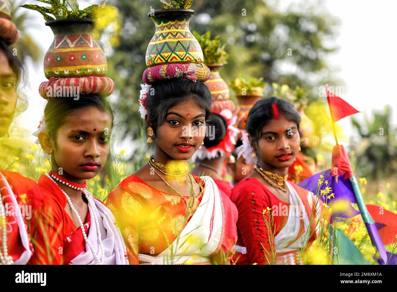 Young girls pose for photo during the immersion of Tusu Festival on ...