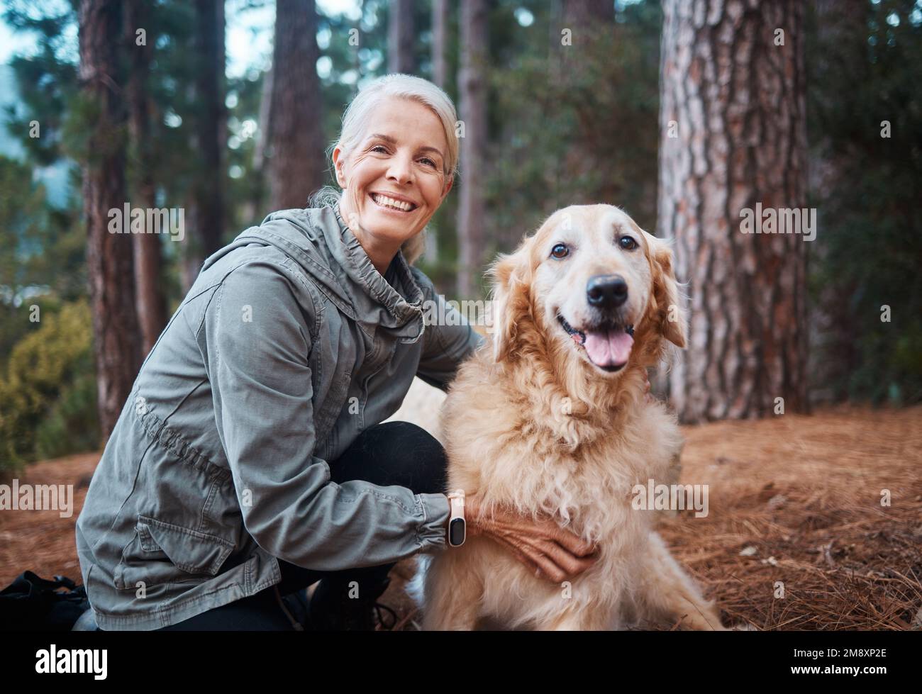 Hes my favourite hiking partner. a senior woman out for a hike with her ...
