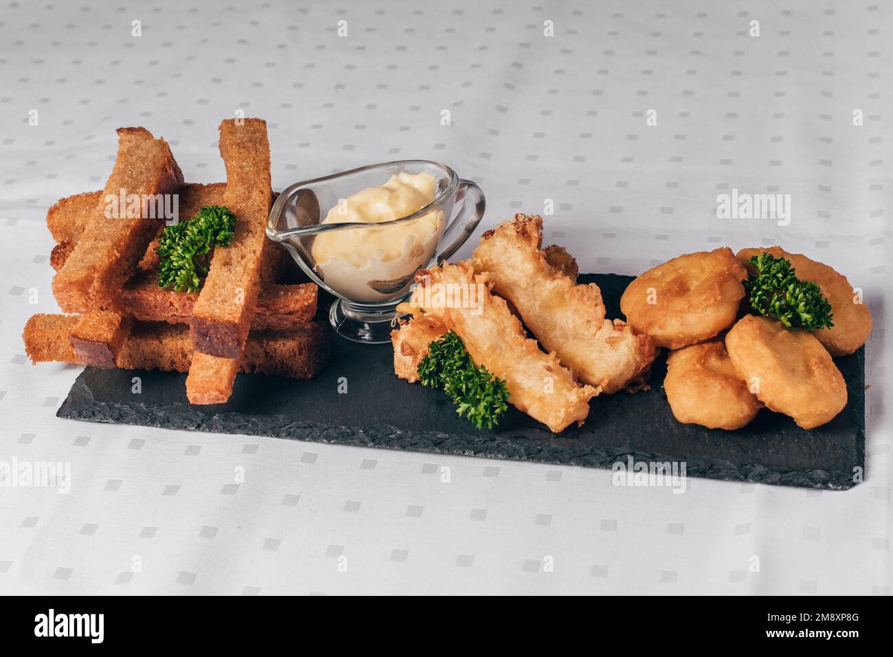set of snacks, breaded and served with sauce Stock Photo - Alamy