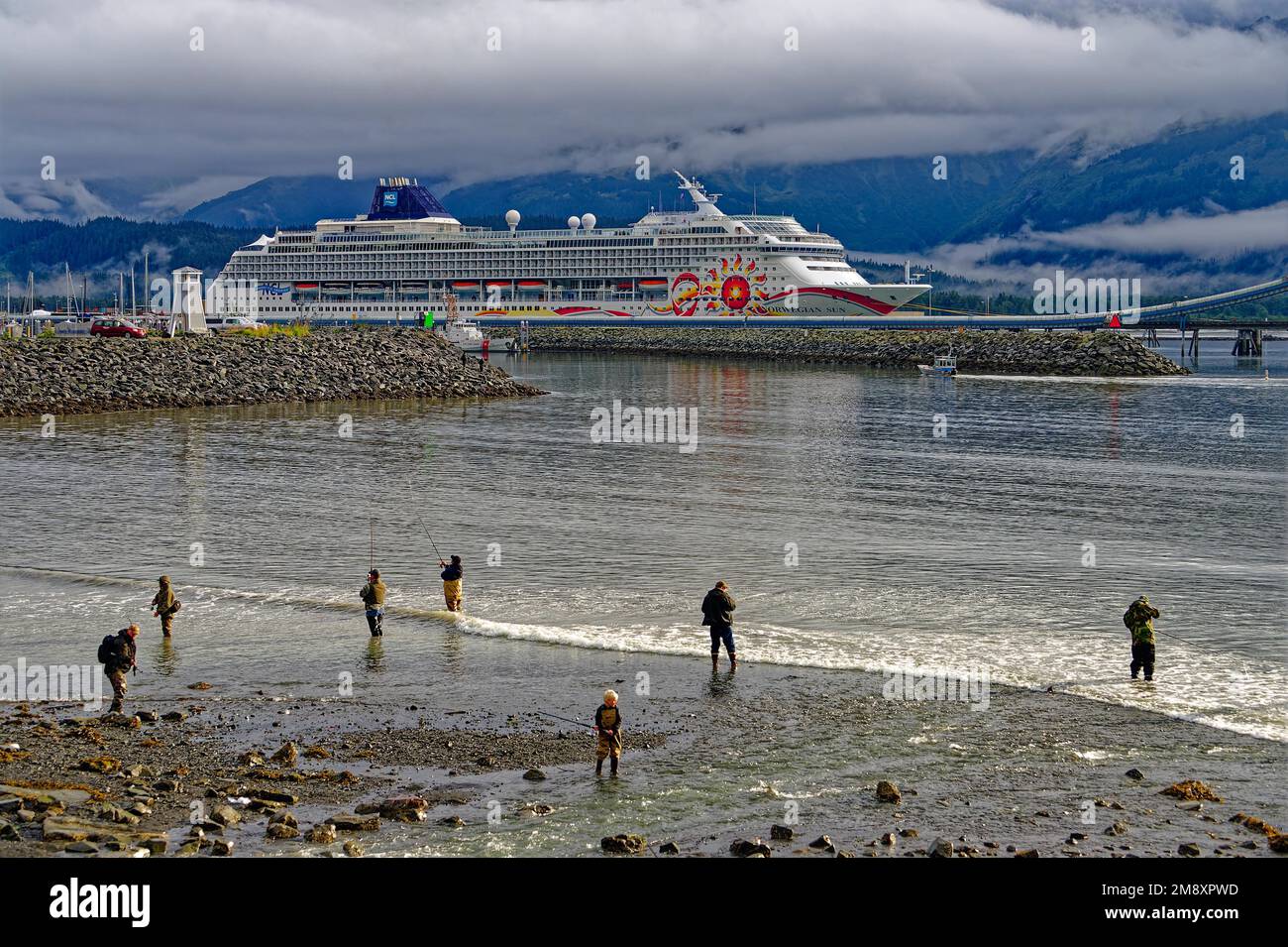 Cruise ship, Seward harbour, Kenai coastal mountains behind, fishermen ...