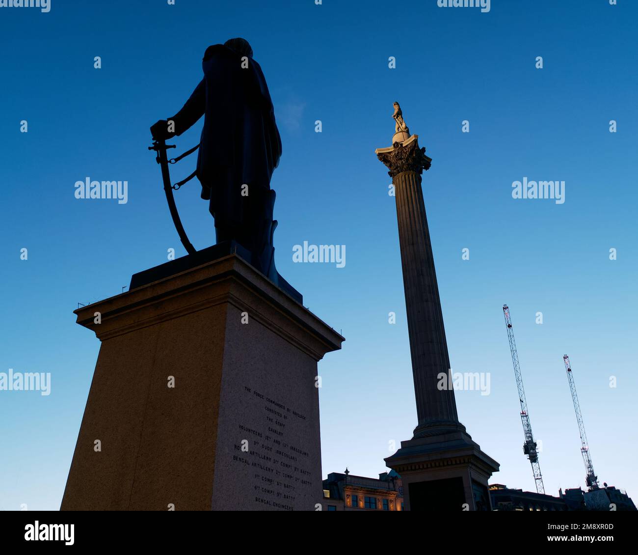 Sir Henry Havelock statue in silhouette and Nelsons Column partially ...