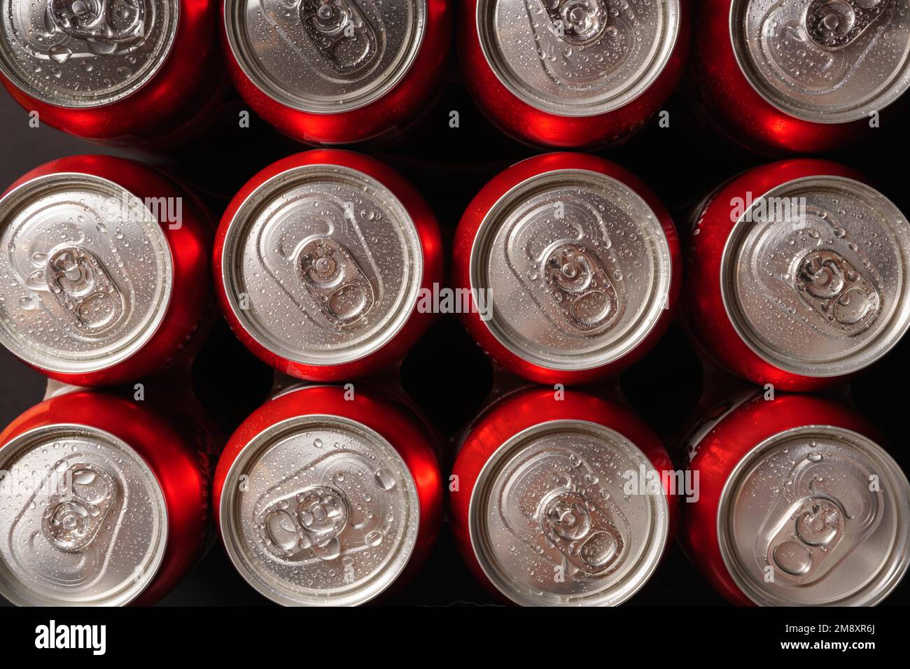 Group of fresh beer cans with drops of water with black background ...