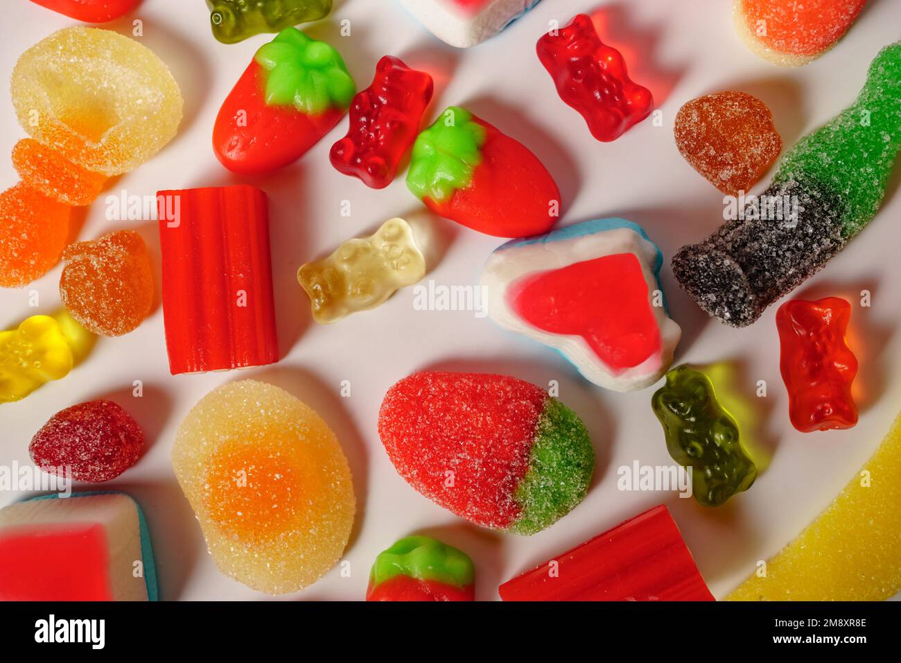 Various types of assorted jelly candy on white background Stock Photo ...