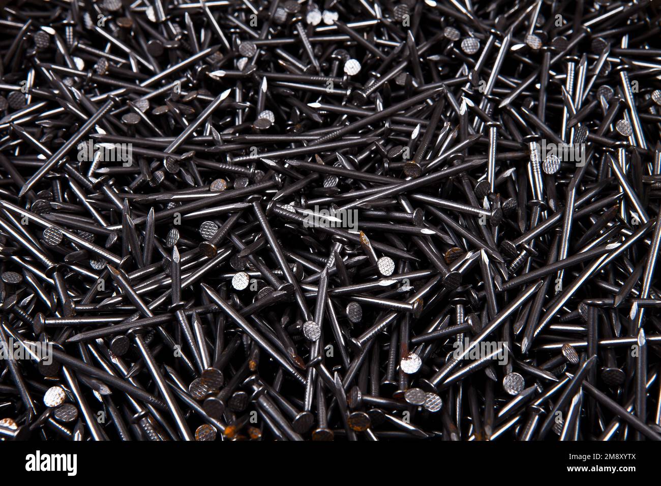 Piles of iron nails used in carpentry Stock Photo - Alamy