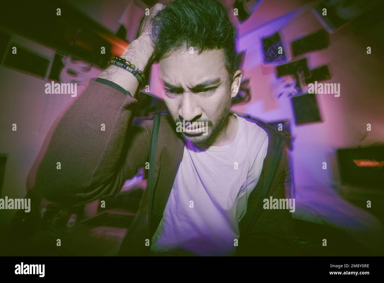 Asian man with mental disorder sitting alone at night feeling paranoid ...