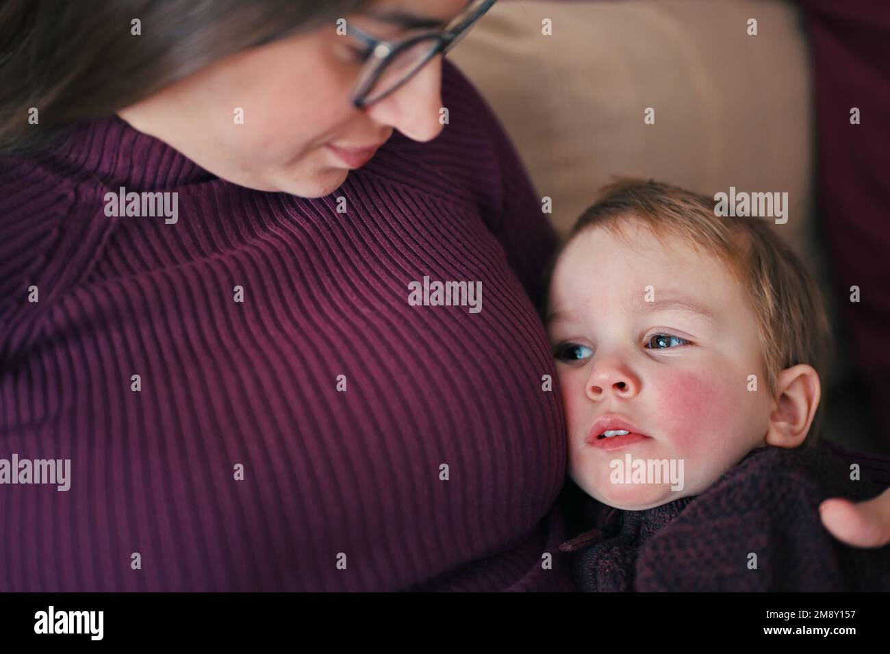Mother comforts her sick little boy Stock Photo - Alamy