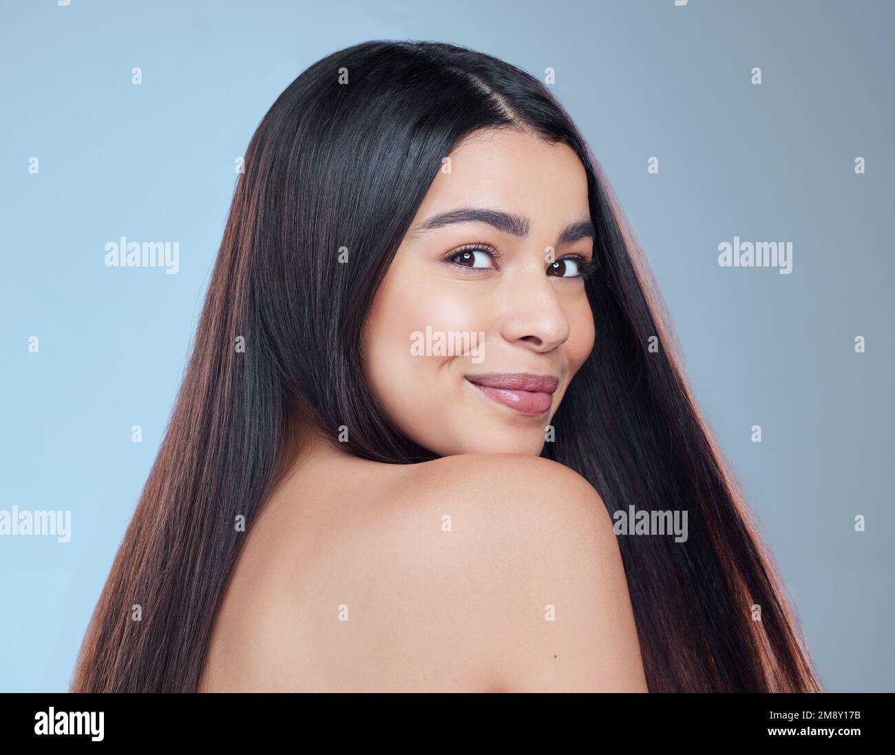 Hair growth vibes. Studio portrait of a beautiful young woman showing ...