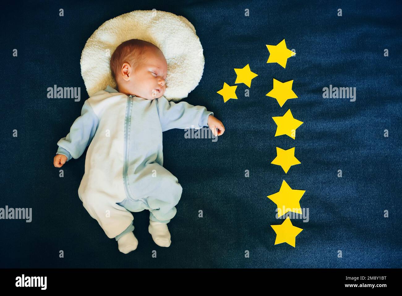 newborn one-month-old boy is sleeping. The figure of one of the ...