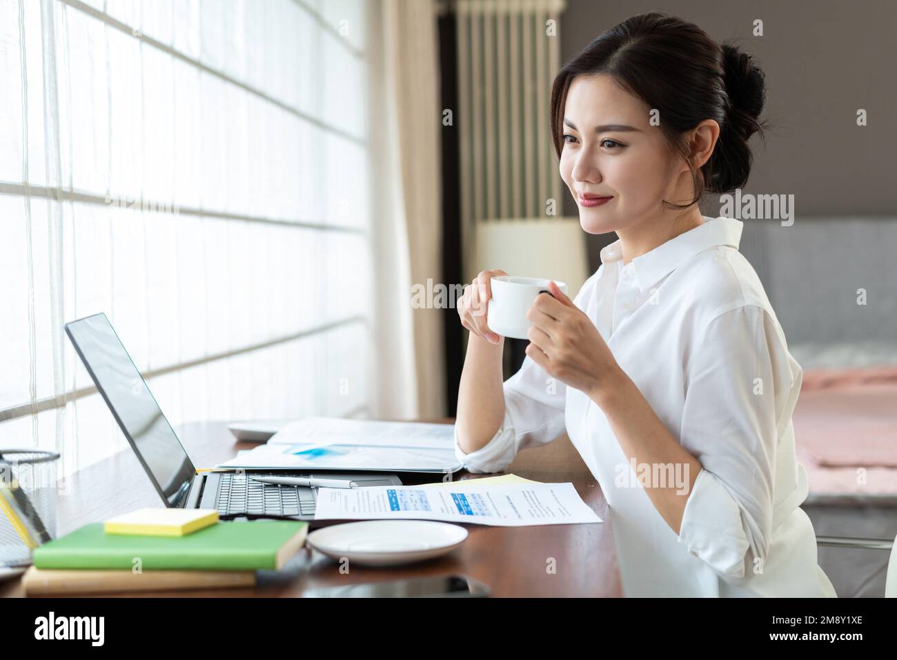 Business woman use the computer at the hotel Stock Photo - Alamy