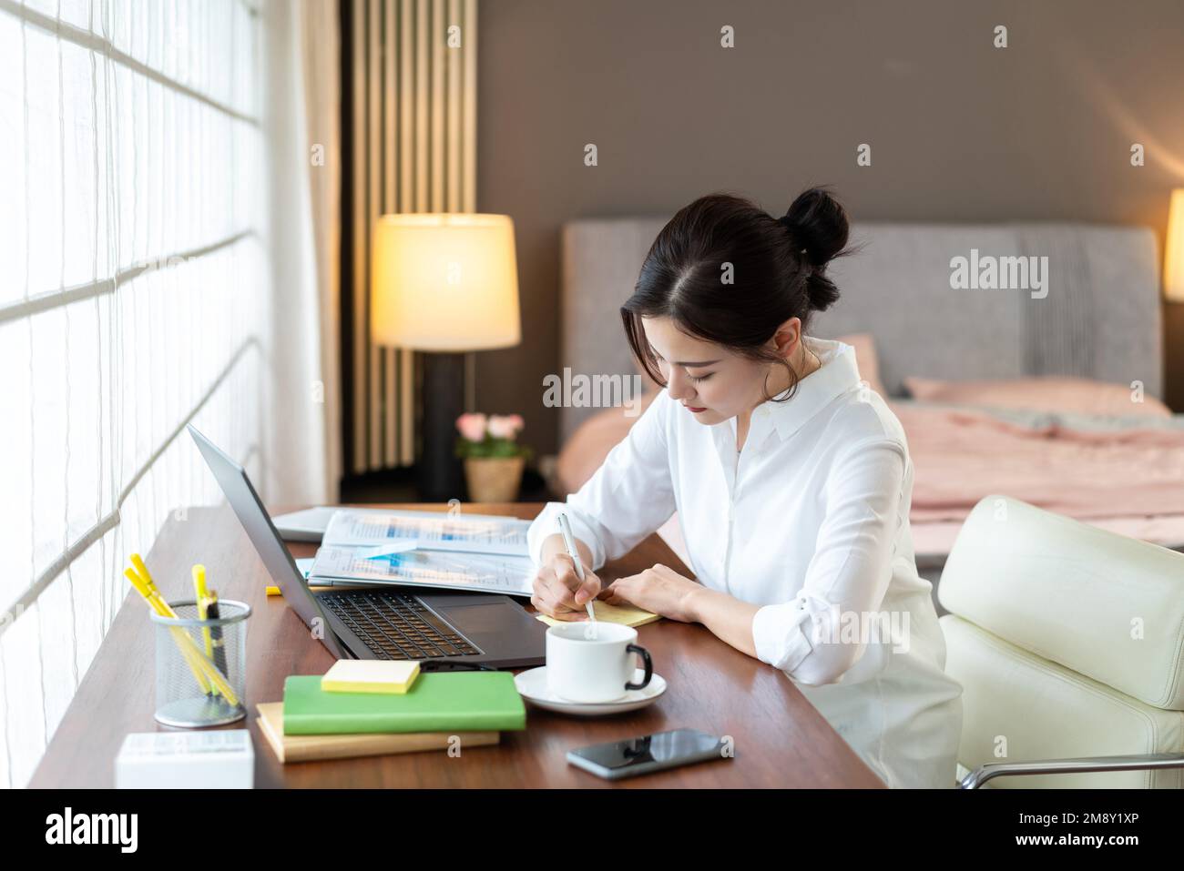 Business woman use the computer at the hotel Stock Photo - Alamy