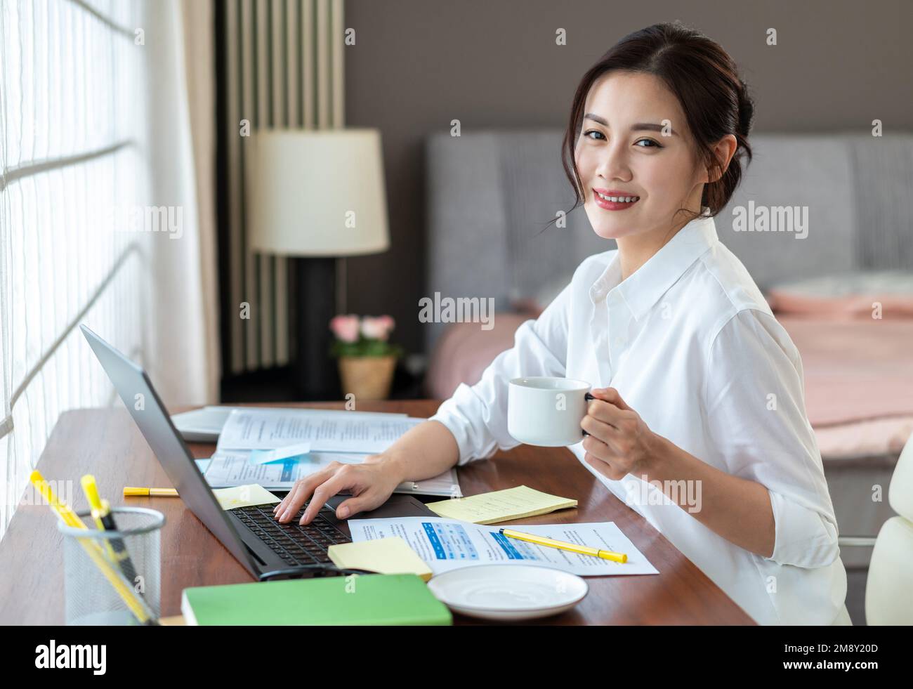 Business woman use the computer at the hotel Stock Photo - Alamy
