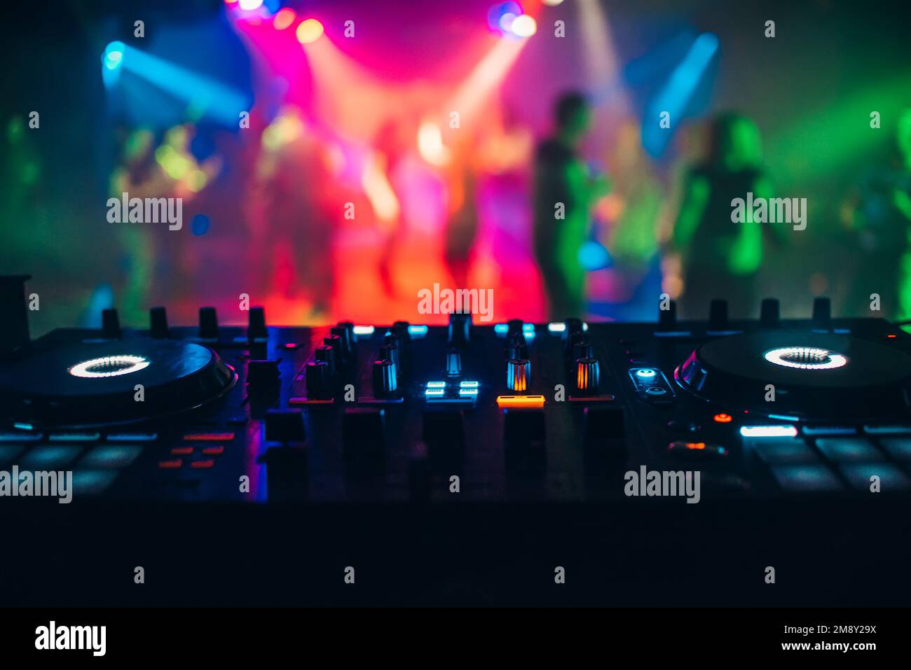 DJ mixer controller panel for playing music and partying in a nightclub ...