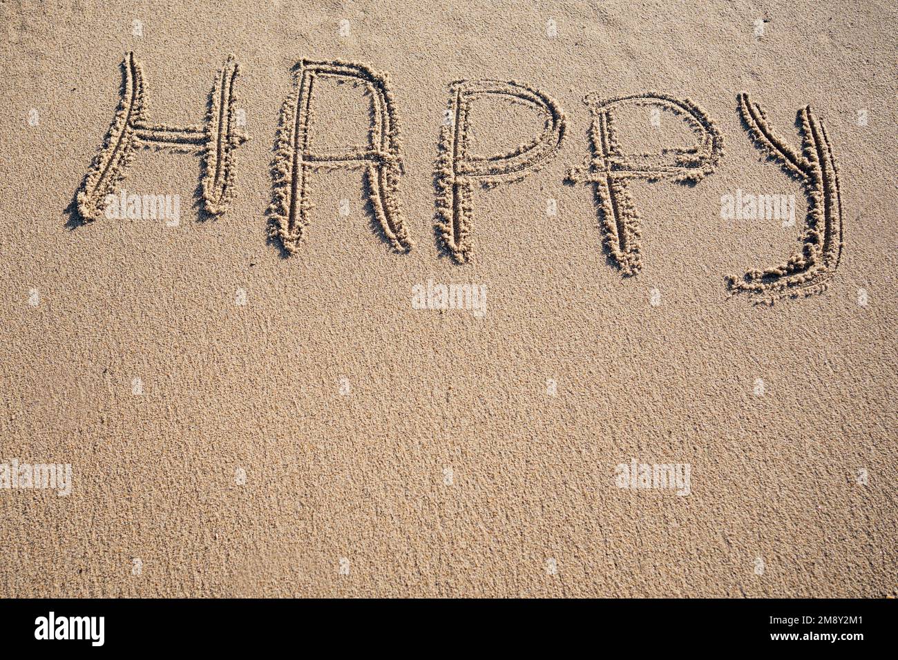Word relax written on sand hi-res stock photography and images - Alamy