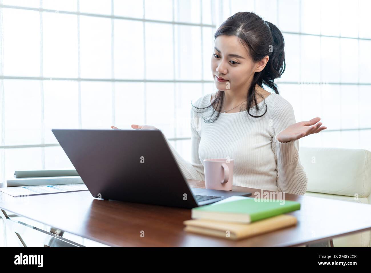 A young woman use the computer Stock Photo - Alamy