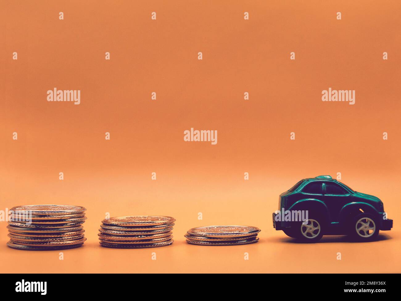 Car toy vehicle with stack coin money on yellow background. Planning to ...