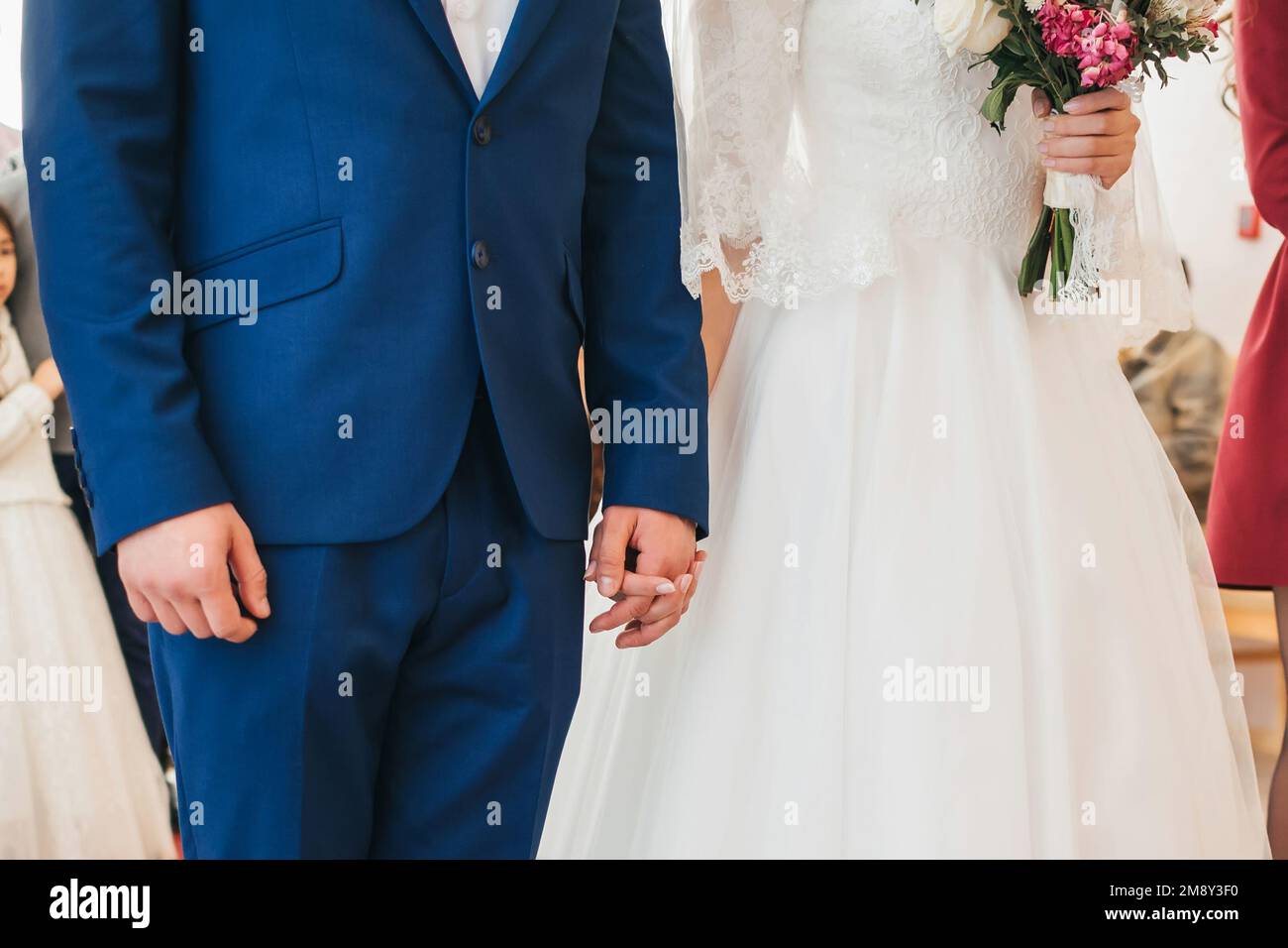 bride and groom at the wedding ceremony holding hands together Stock ...