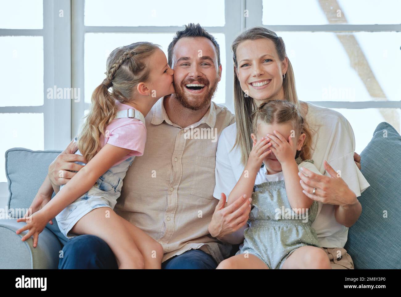 Simple family days. a young family relaxing together at home Stock ...