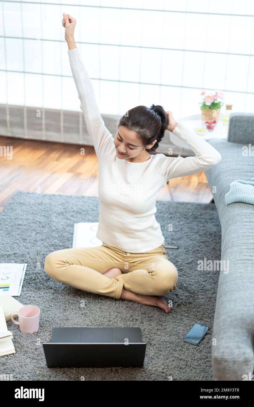 A young woman to use a computer at home Stock Photo - Alamy