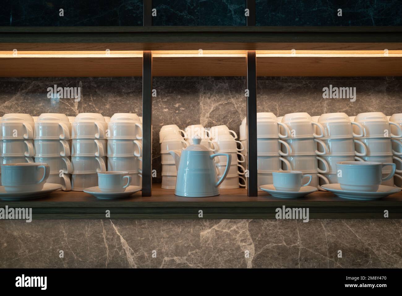 Cups arranged properly and orderly inside a cupboard Stock Photo - Alamy