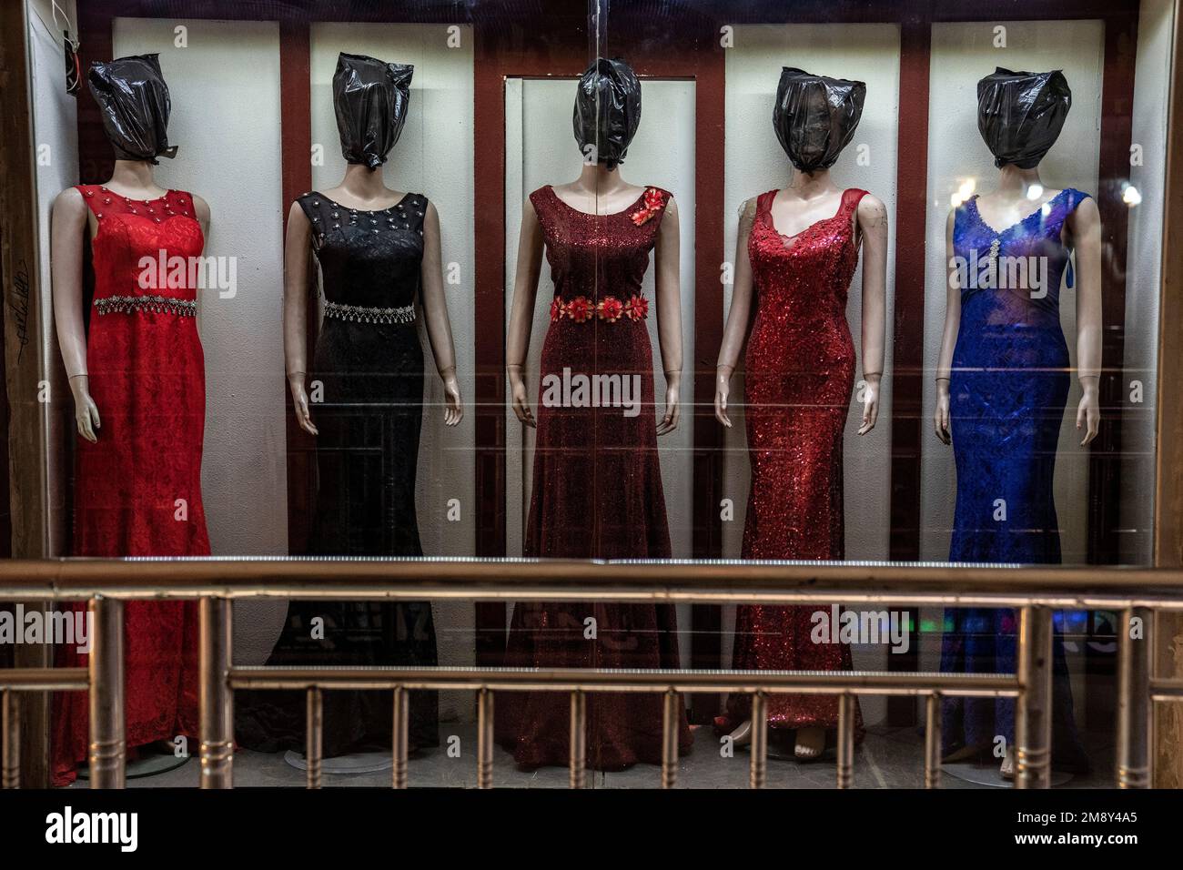 Mannequin's heads are covered in a women's dress store store in Kabul, Afghanistan, Monday, Dec ...