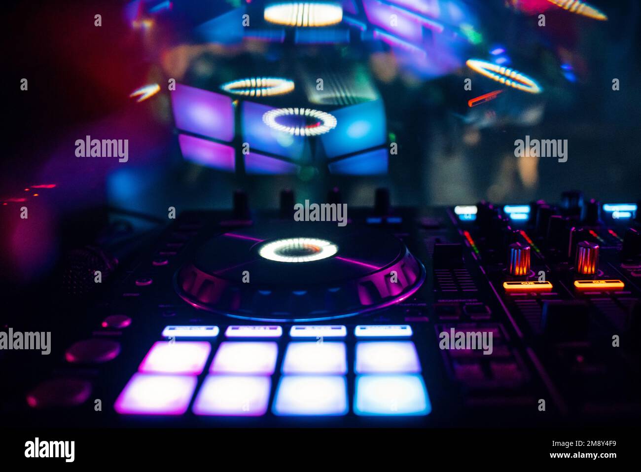 professional DJ mixer controller for mixing music in a nightclub with ...