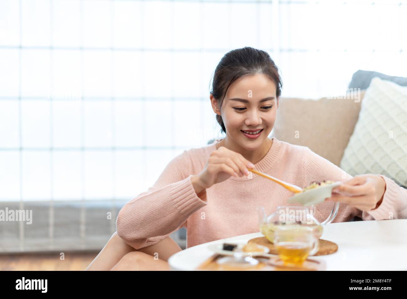 The young lady have afternoon tea at home Stock Photo - Alamy