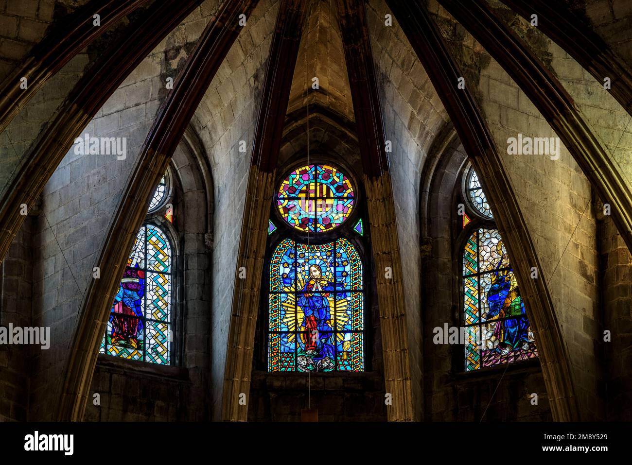 Stained glass windows and arches of the vaults of the apse inside the ...