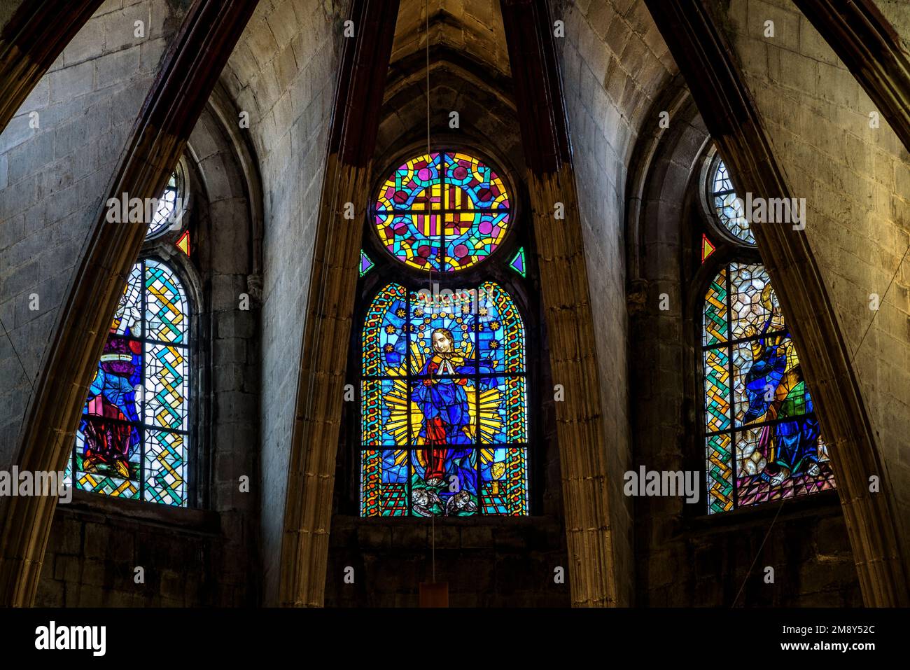 Stained glass windows and arches of the vaults of the apse inside the ...
