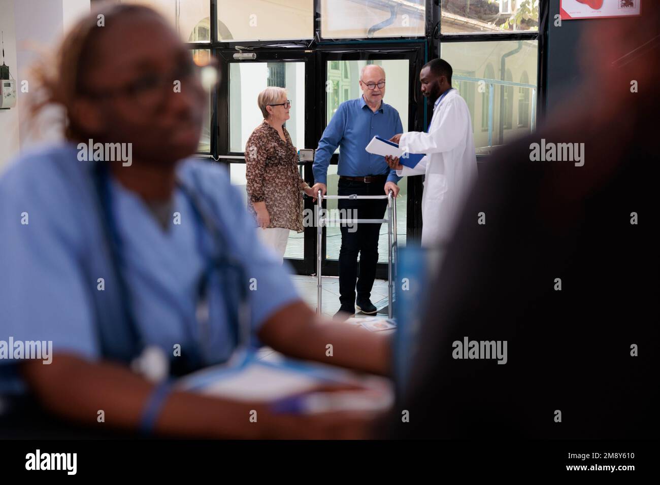 Selective focus on elderly couple having medical appointment with ...