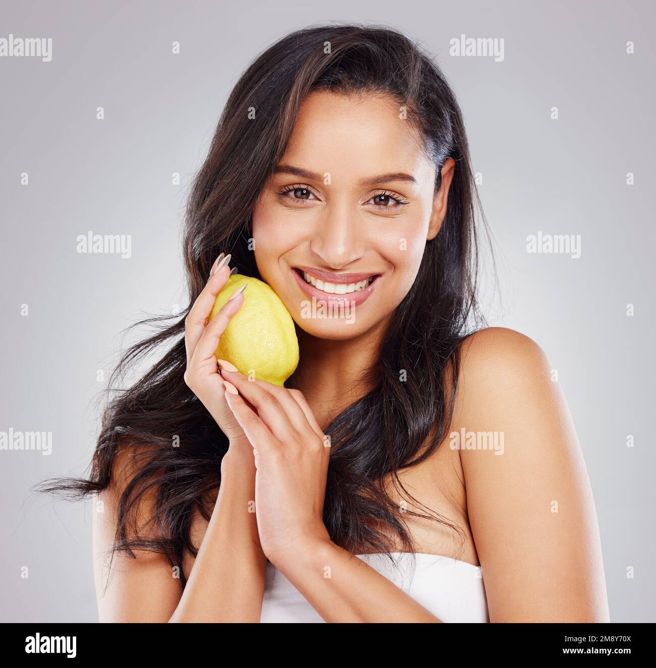 Vitamin C aids in hair growth. Cropped portrait of an attractive young ...