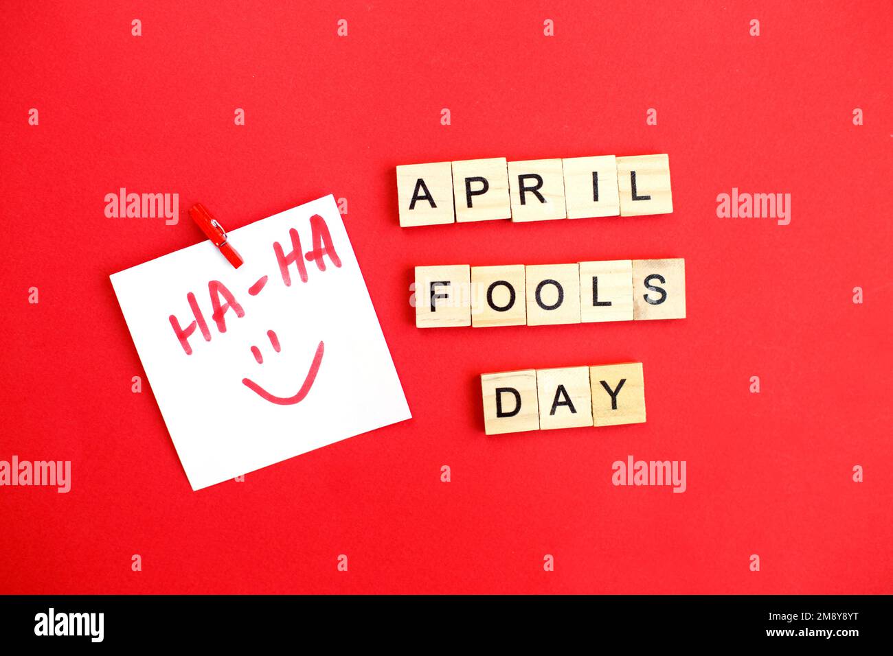 sticker with smiley hanging on the pin and the inscription april fools ...