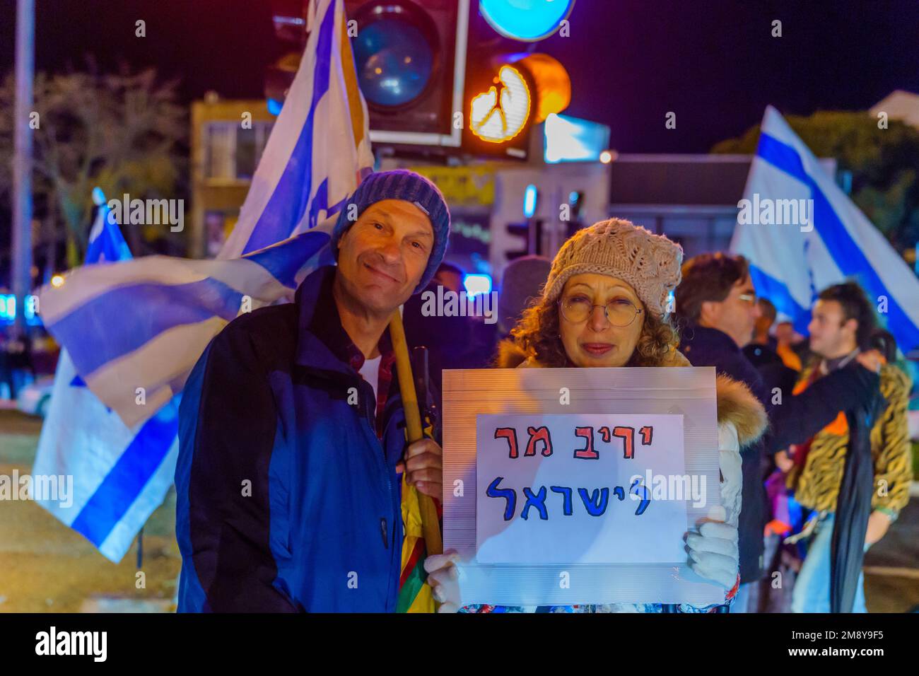Haifa, Israel - January 14, 2023: People protest with signs against the ...