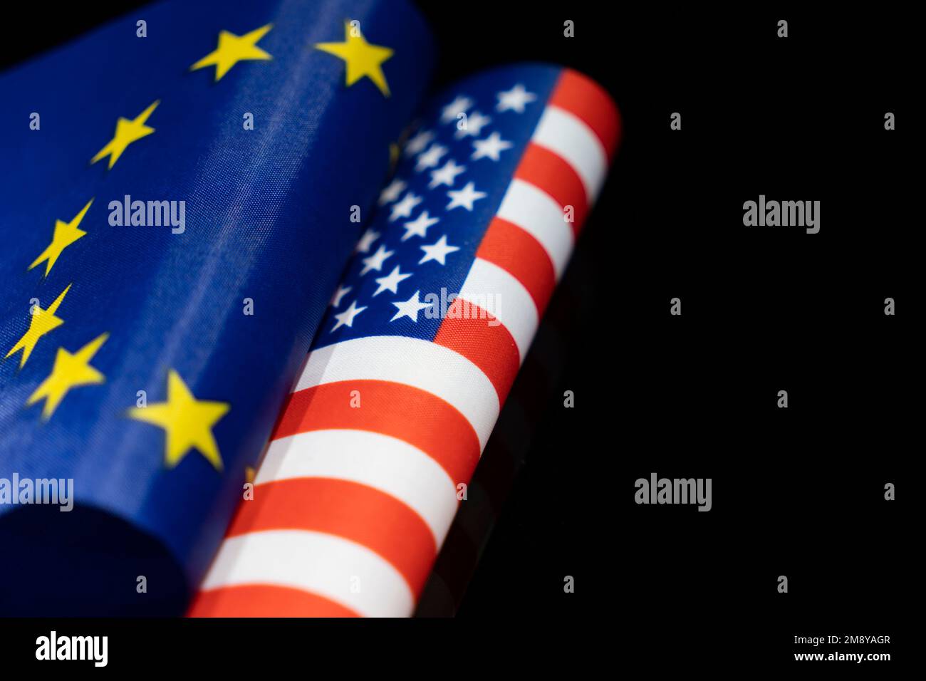 flags of USA and European Union on a black background. The concept of ...