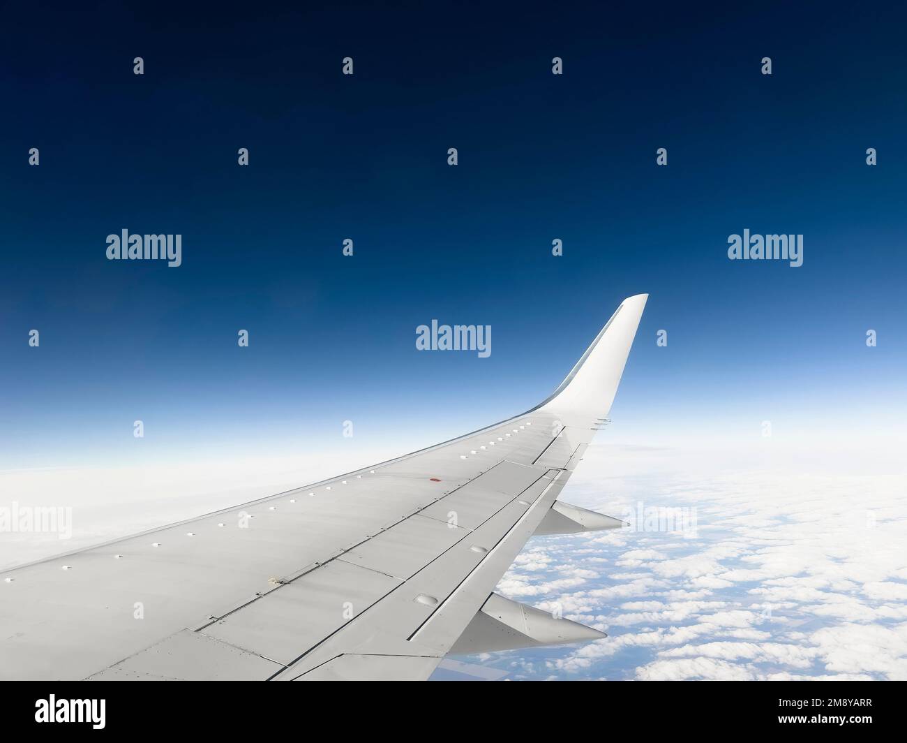 White wing from airplane window on sunny day. Great views of landscape ...